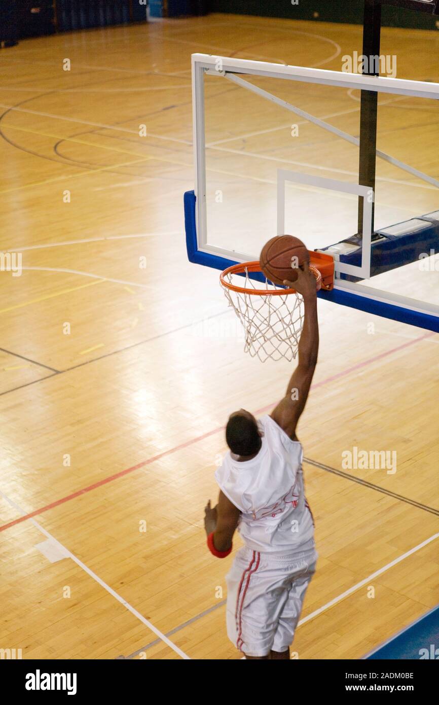MODEL RELEASED. Basketball player scoring a point Stock Photo - Alamy