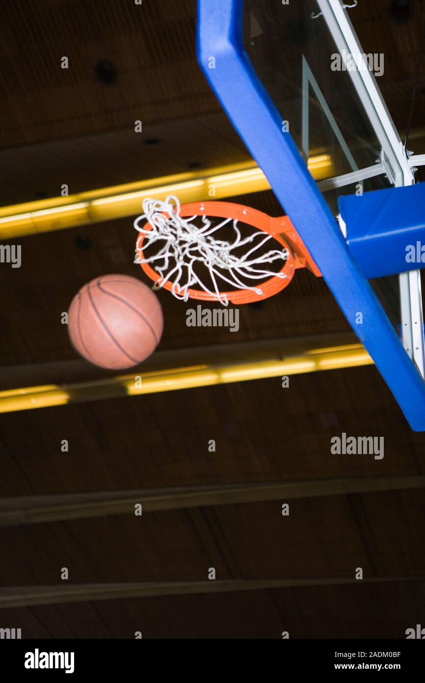 Basketball falling through the net Stock Photo - Alamy