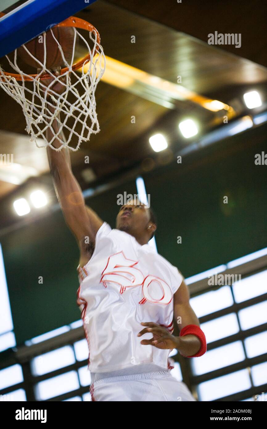 MODEL RELEASED. Basketball player scoring a point Stock Photo - Alamy