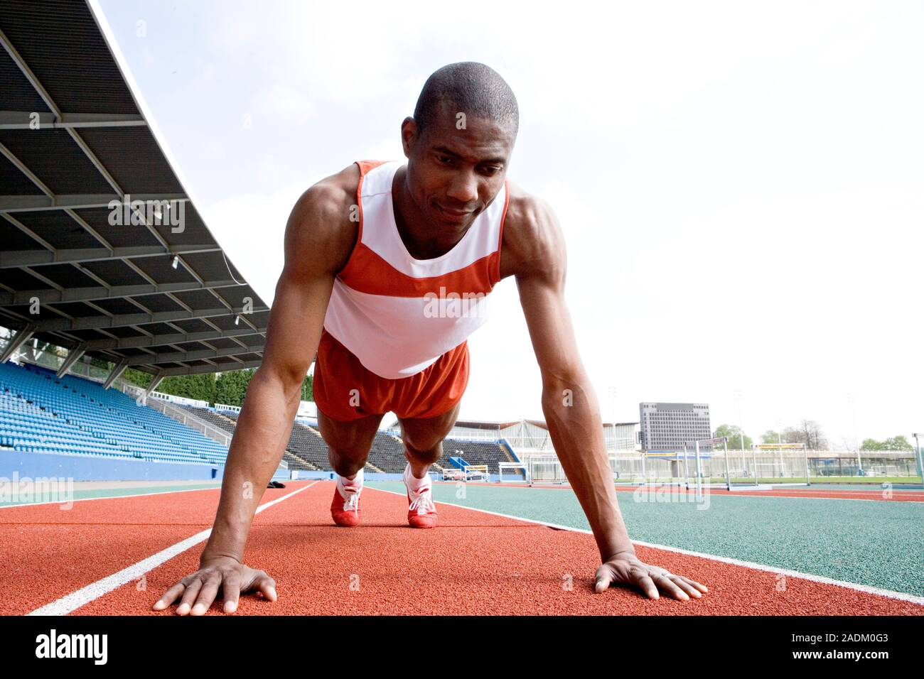 MODEL RELEASED. Athlete doing press-ups. A press-up is a physical ...