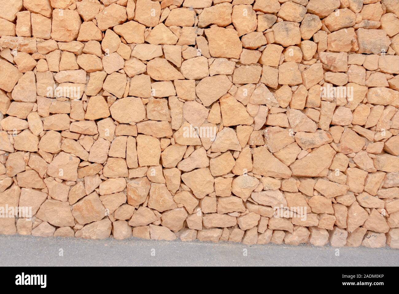 Masonry wall of stones with irregular pattern texture background Stock ...