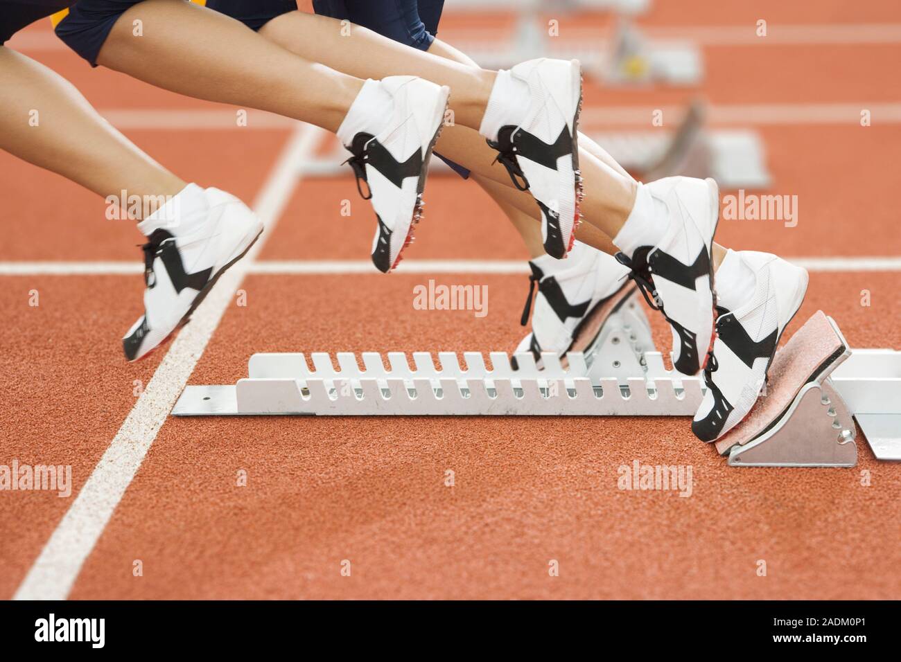 Athlete leaving the blocks. Composite high-speed photograph of an ...
