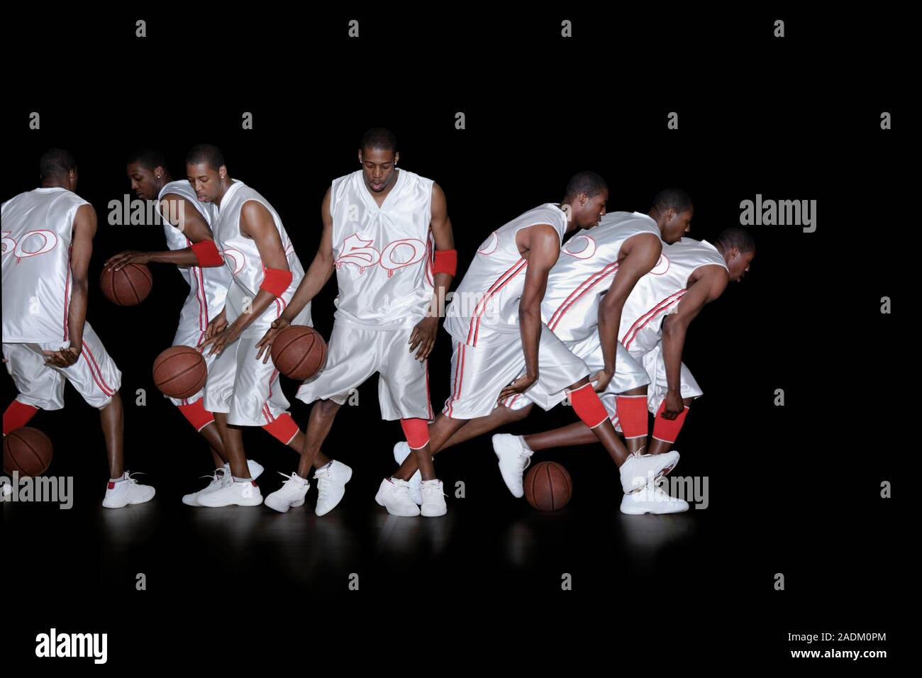 MODEL RELEASED. Basketballer dribbling. Composite high-speed photograph ...