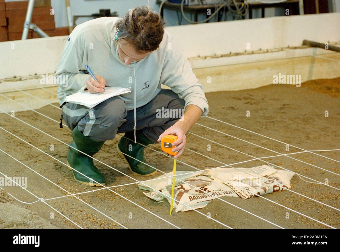 Wave tank experiment. Student conducting an experiment in a wave ...
