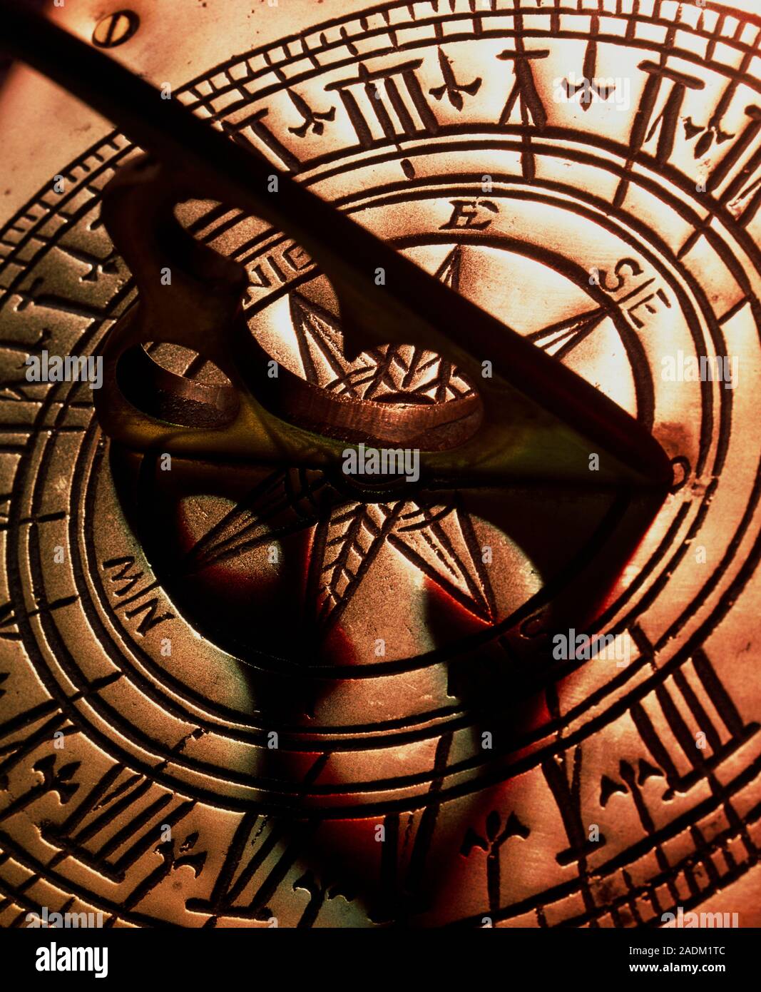 Sundial. View of a metal sundial. The sundial measures time using a ...