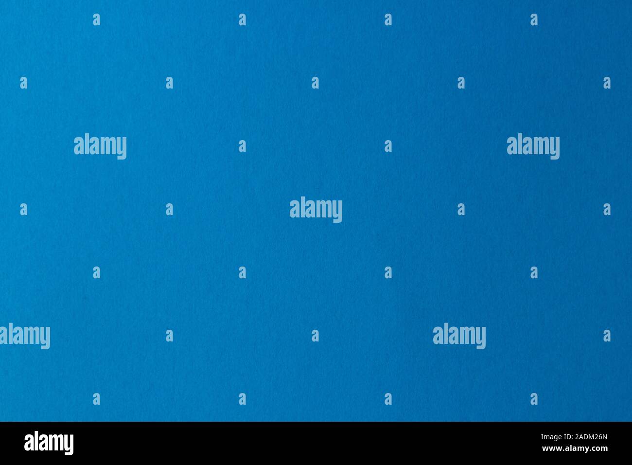 Light blue paper background with copy space for text. Rough paper ...