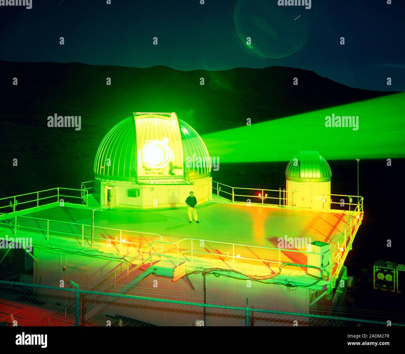 Starfire laser beam. A copper vapour laser beam (green) being projected ...