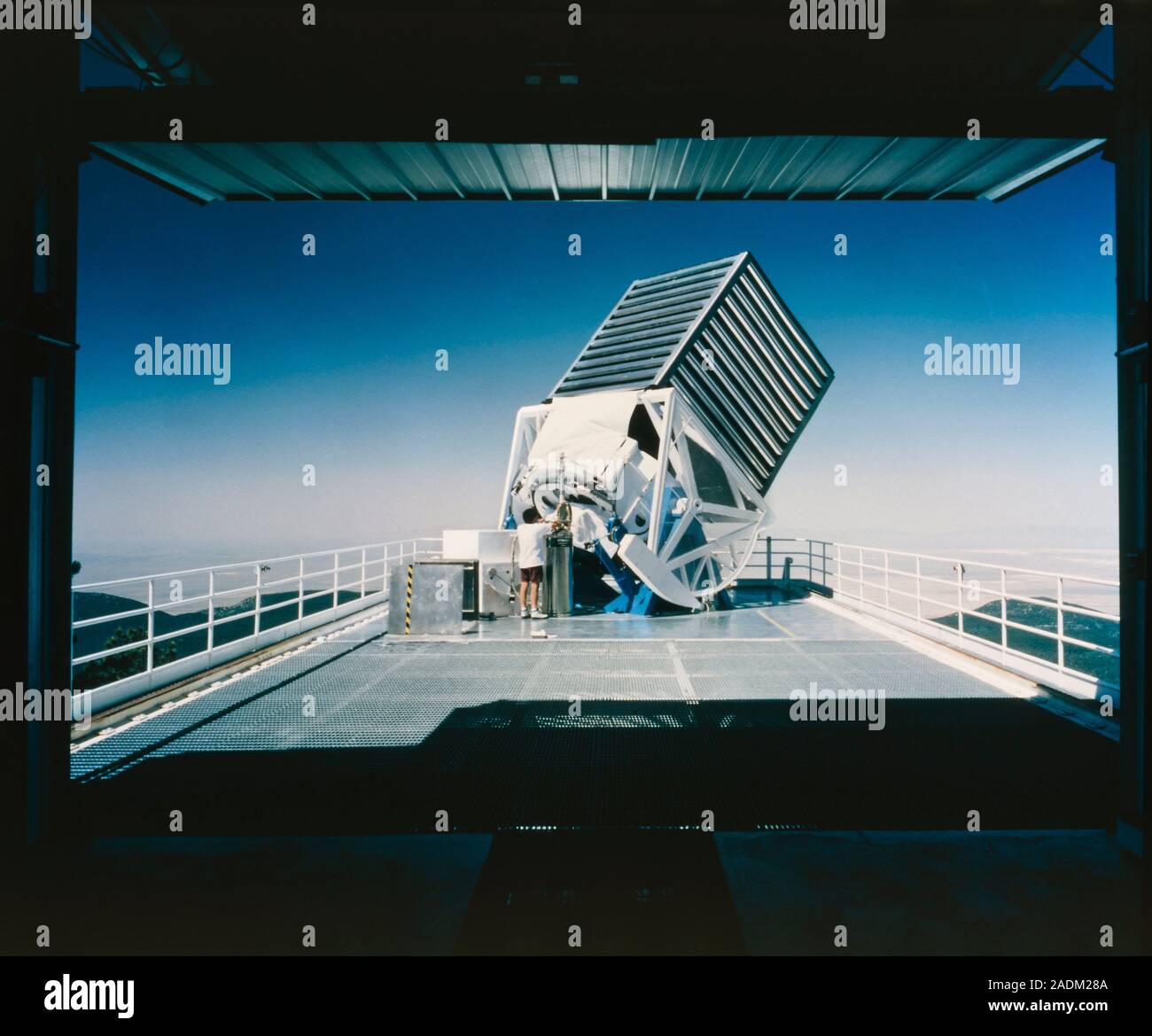 SDSS Telescope. View of a male astronomer working on the main telescope ...