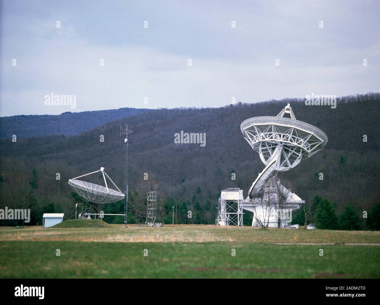 Two of the five dish antennas at the Greenbank National Radio Observatory. On the left is the 17 ...