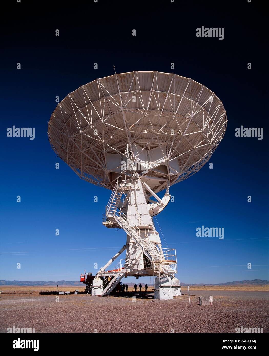 Moving a VLA antenna (image 1 of 2). Technicians prepare to move a dish ...