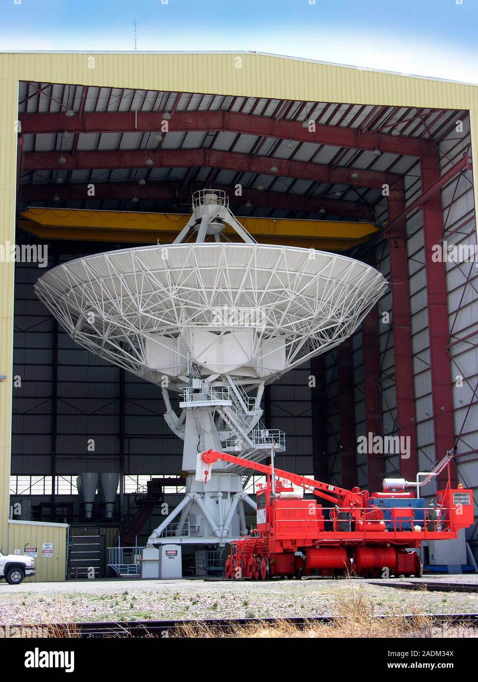 Very Large Array (VLA) radio antenna undergoing maintenance work in a ...