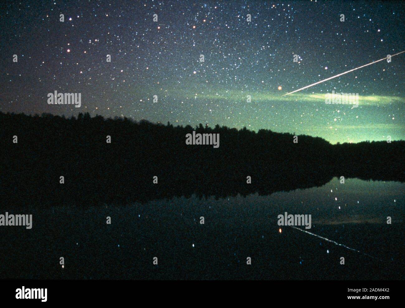 Meteor. Optical image of a meteor track (upper right) in the night sky ...