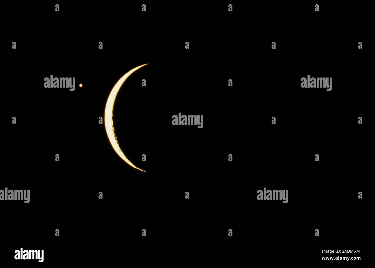 Earth based photograph of the planet Venus (upper left) and crescent ...