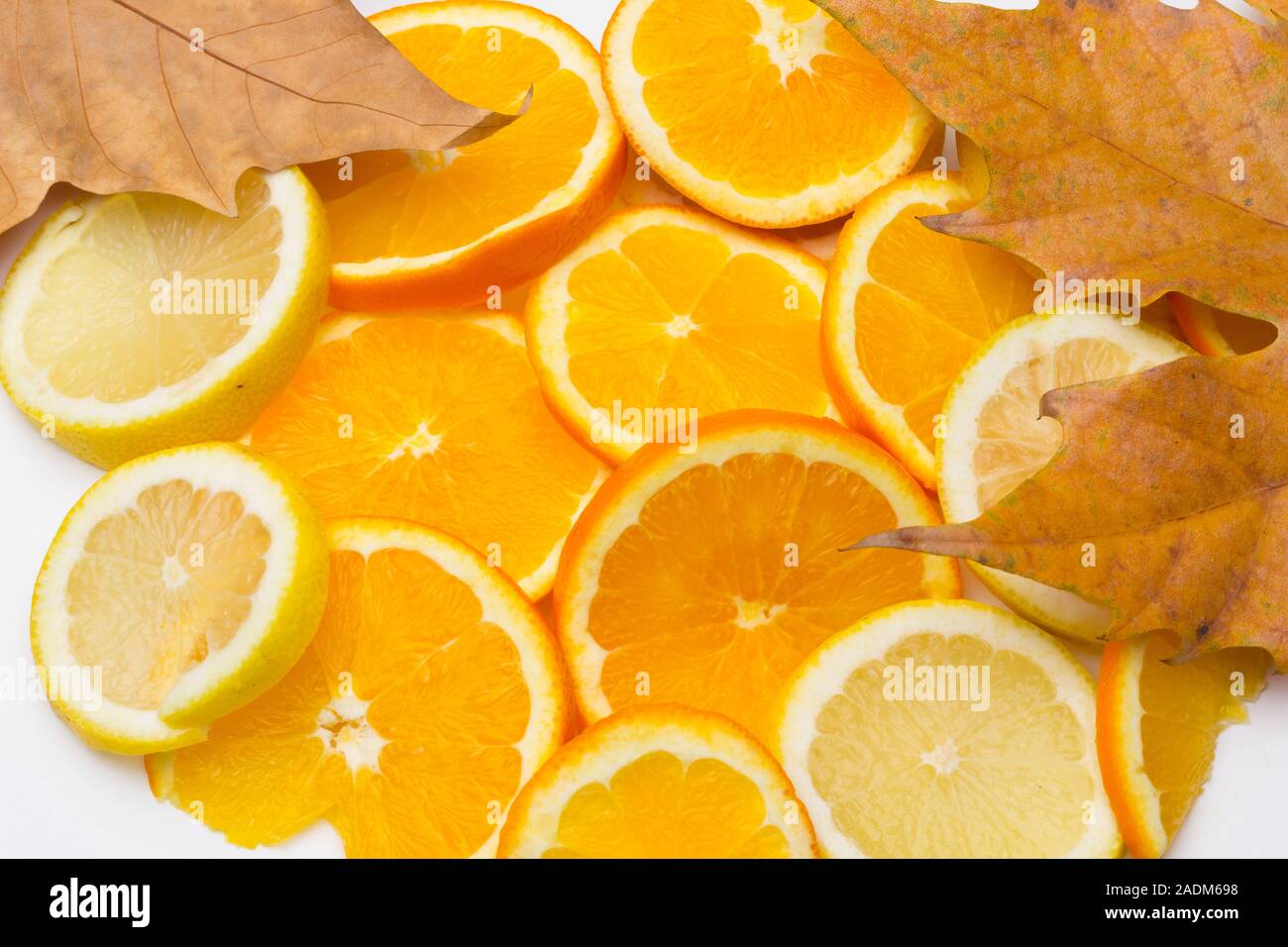 Slices of oranges and lemons, fruits full of juice with which juices ...