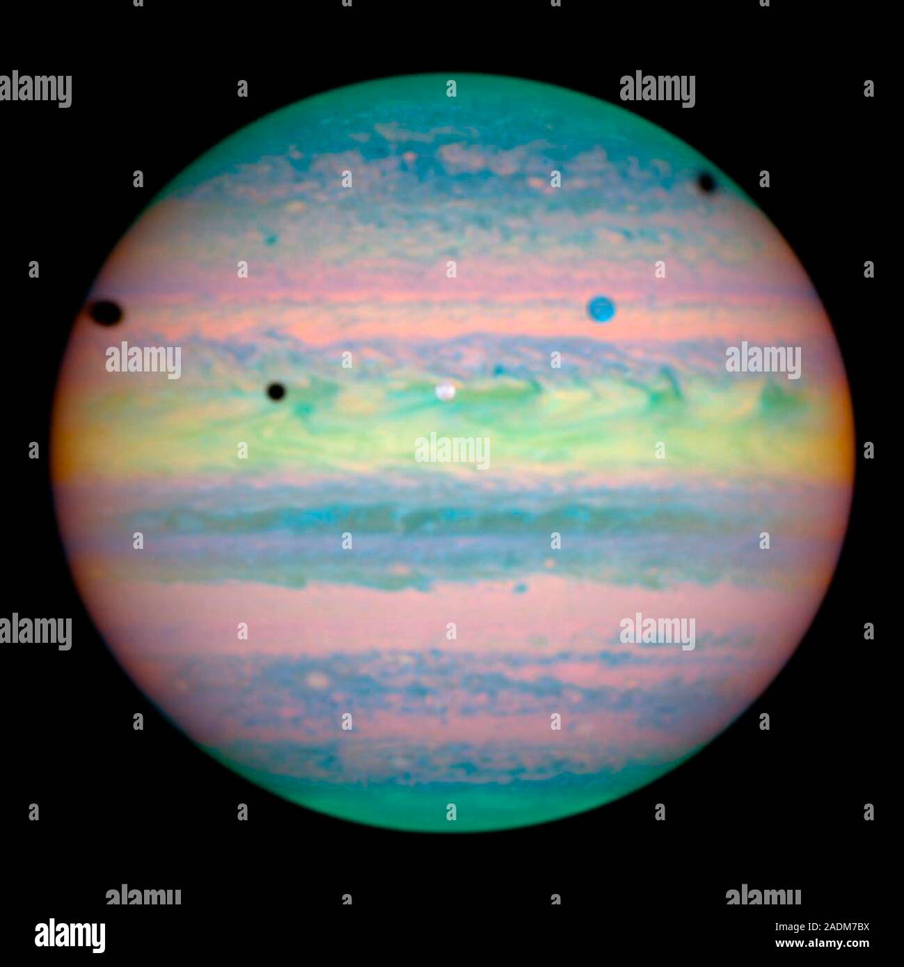 Jupiter and its moons, infrared Hubble Space Telescope image. This image shows a rare alignment ...