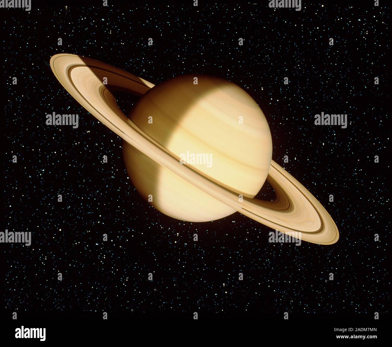 Saturn. Composite artwork of the planet Saturn and its rings seen on a ...
