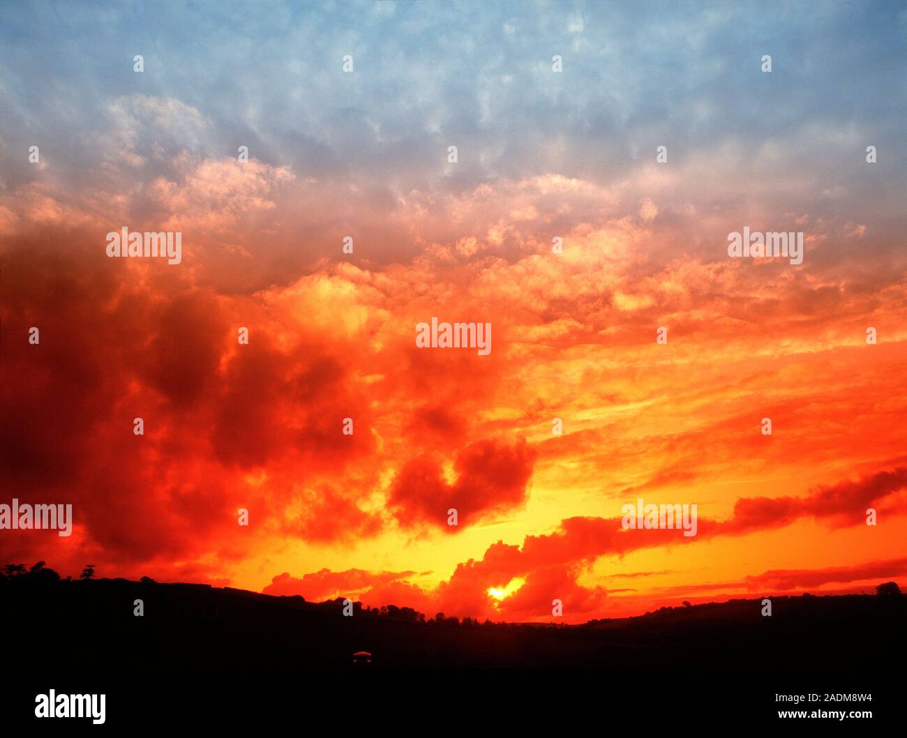 Sunset. Filtered photograph of a sunset with clouds. There are ...