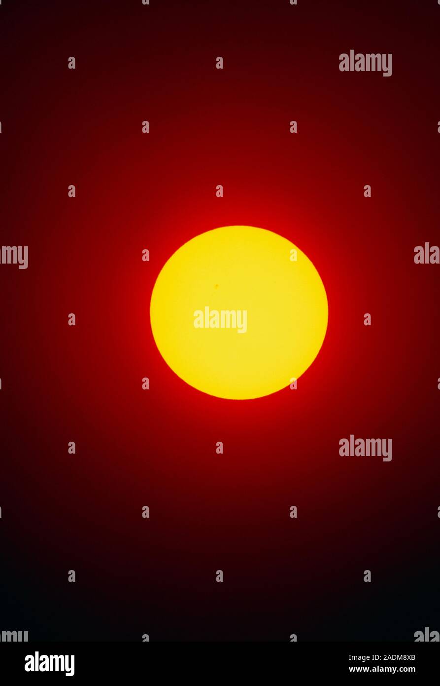 Sunset. Disc of the Sun at sunset in a dark red sky. Solar radiation ...
