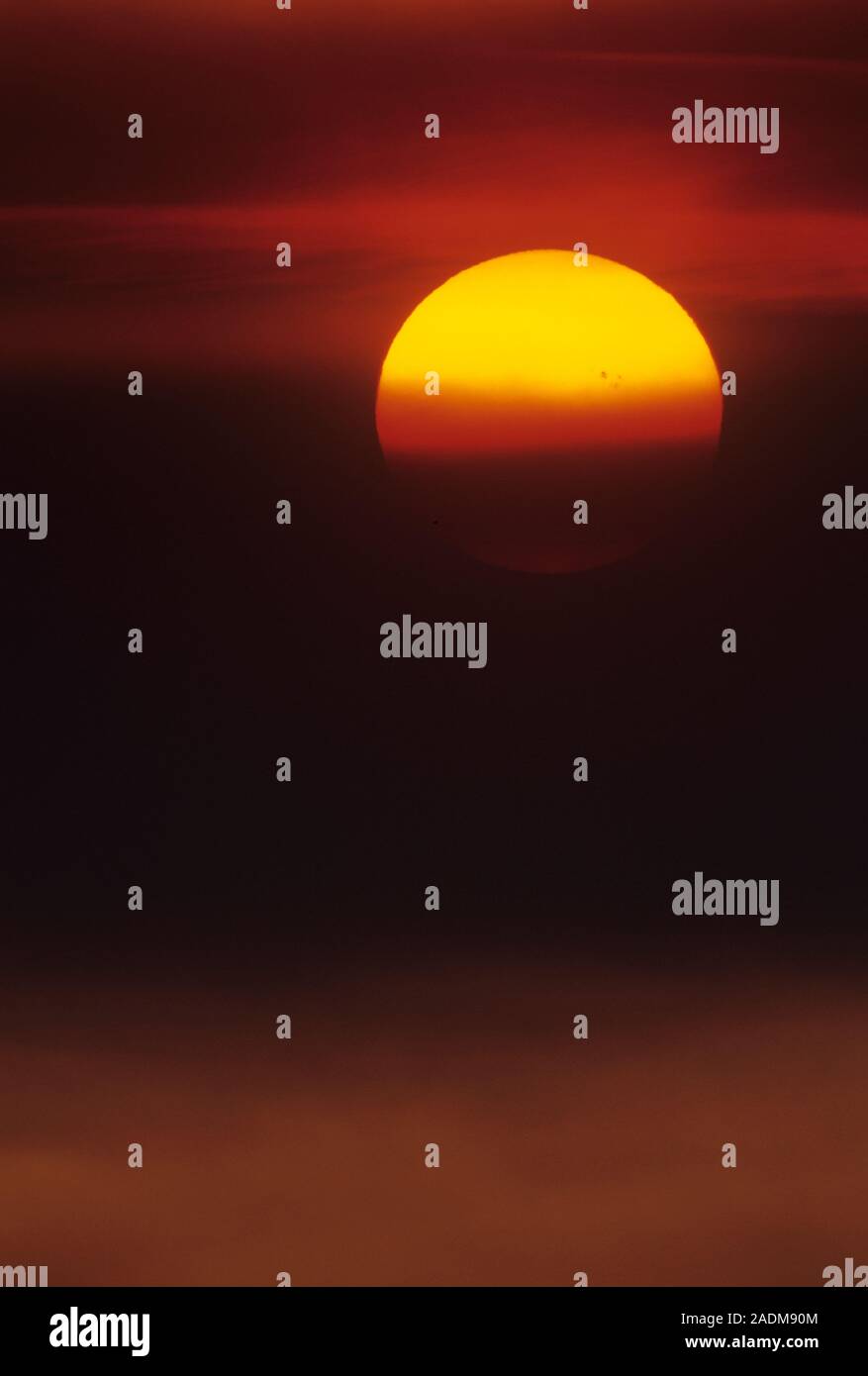 Sunset. Haze caused by a forest fire partially obscuring the sun during ...