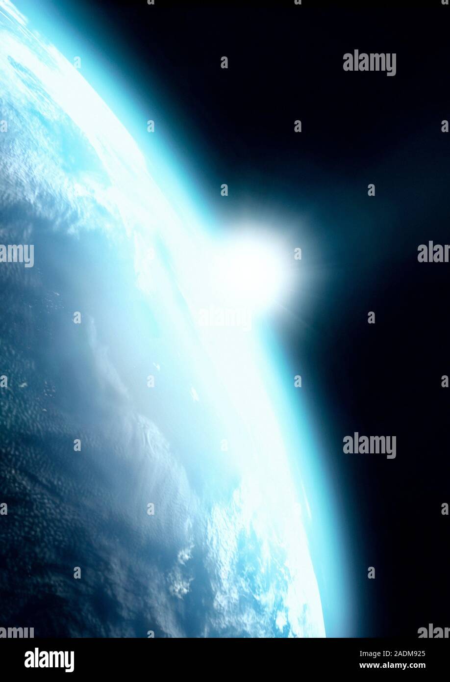 Sunrise from space. Computer artwork of the Sun (upper centre), rising ...