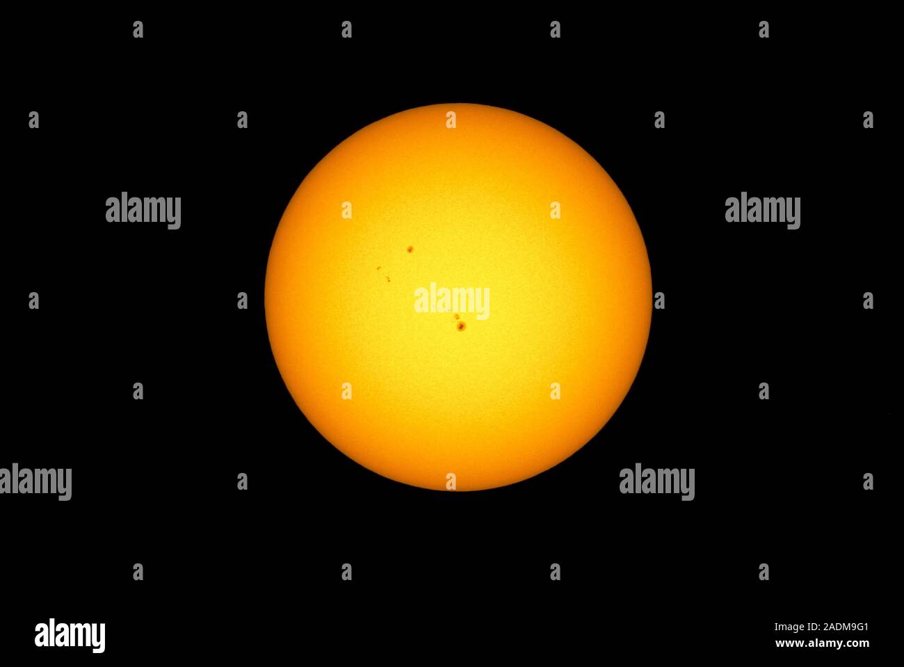 Sun with sunspots. Sunspots are dark regions on the surface of the Sun ...
