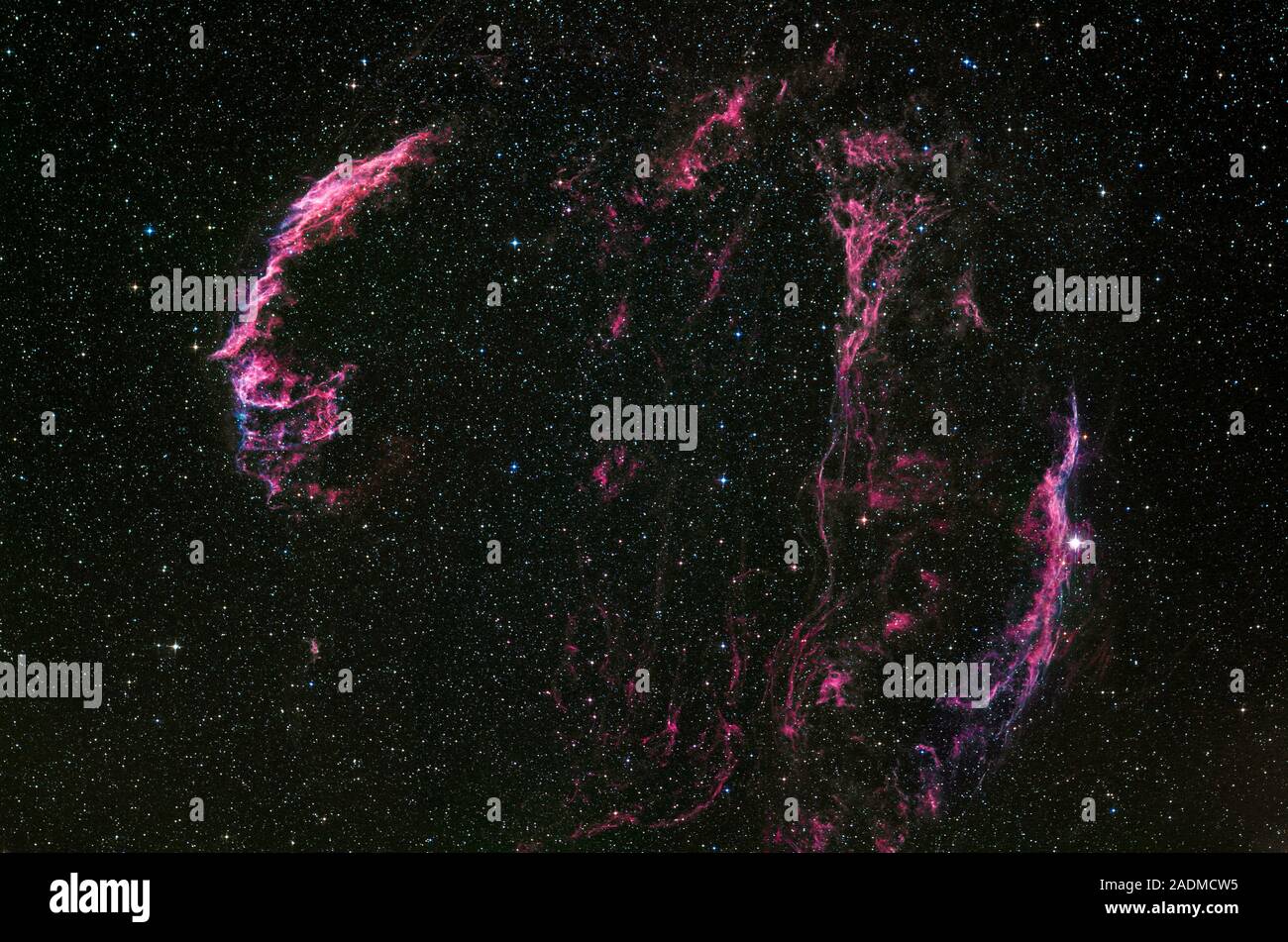Cygnus Loop supernova remnant, optical image. This shell of glowing gas ...