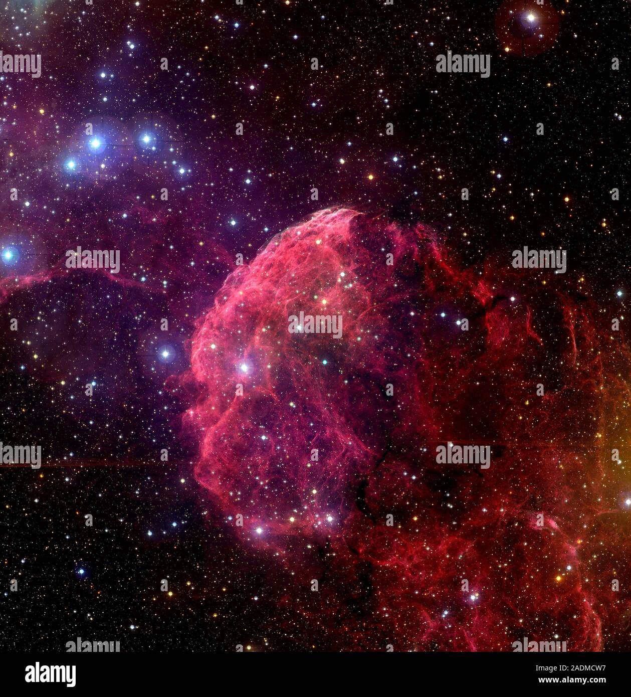 Supernova remnant IC 443, optical image. This large red cloud of gas in ...