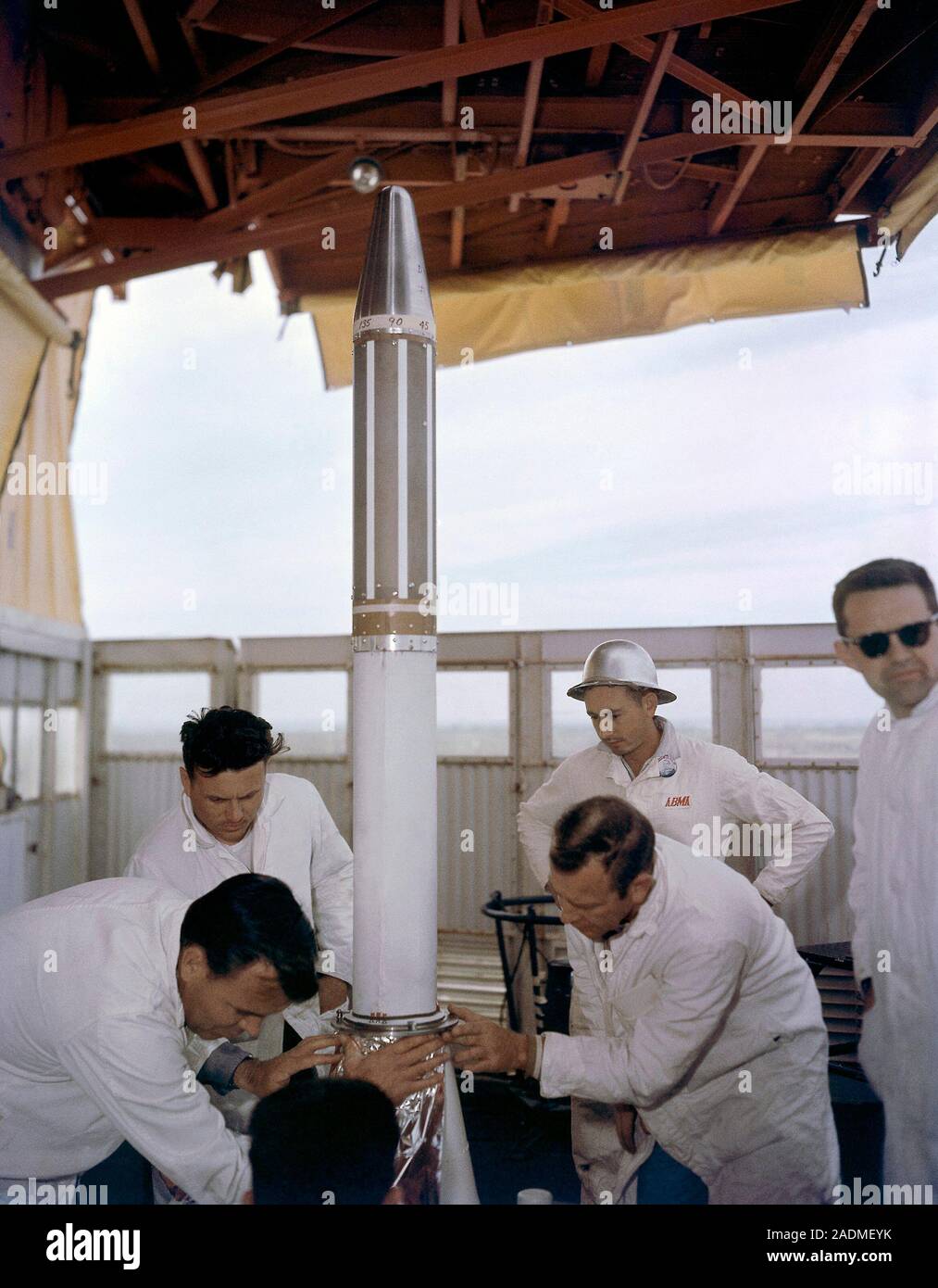 Explorer 1 satellite being attached to its launch vehicle. Explorer 1 ...