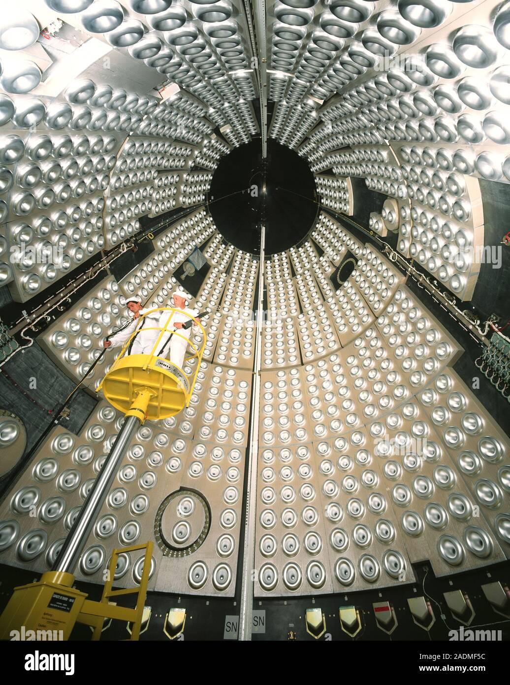 Inside an Ariane 5. Engineers checking the interior of the nose fairing ...