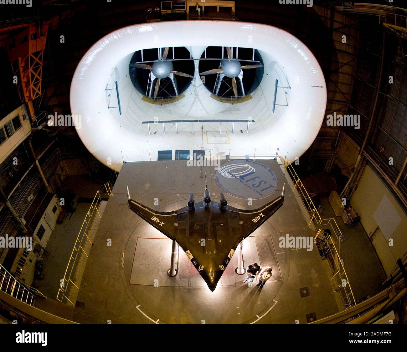 X-48B Blended Wing Body aircraft model. Technicians inspect the sub ...