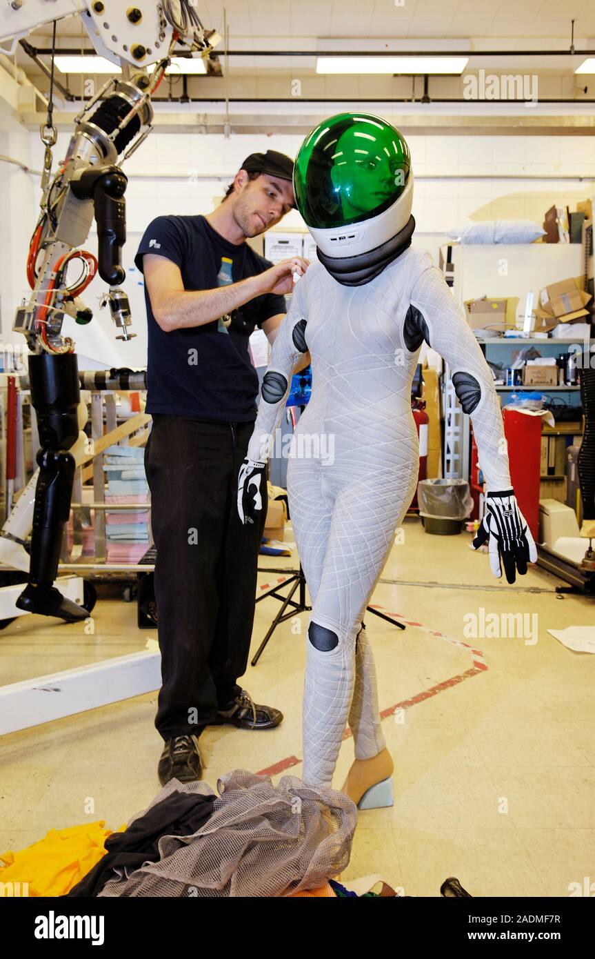 Advanced spacesuit. Researcher adjusting the BioSuit , a prototype ...