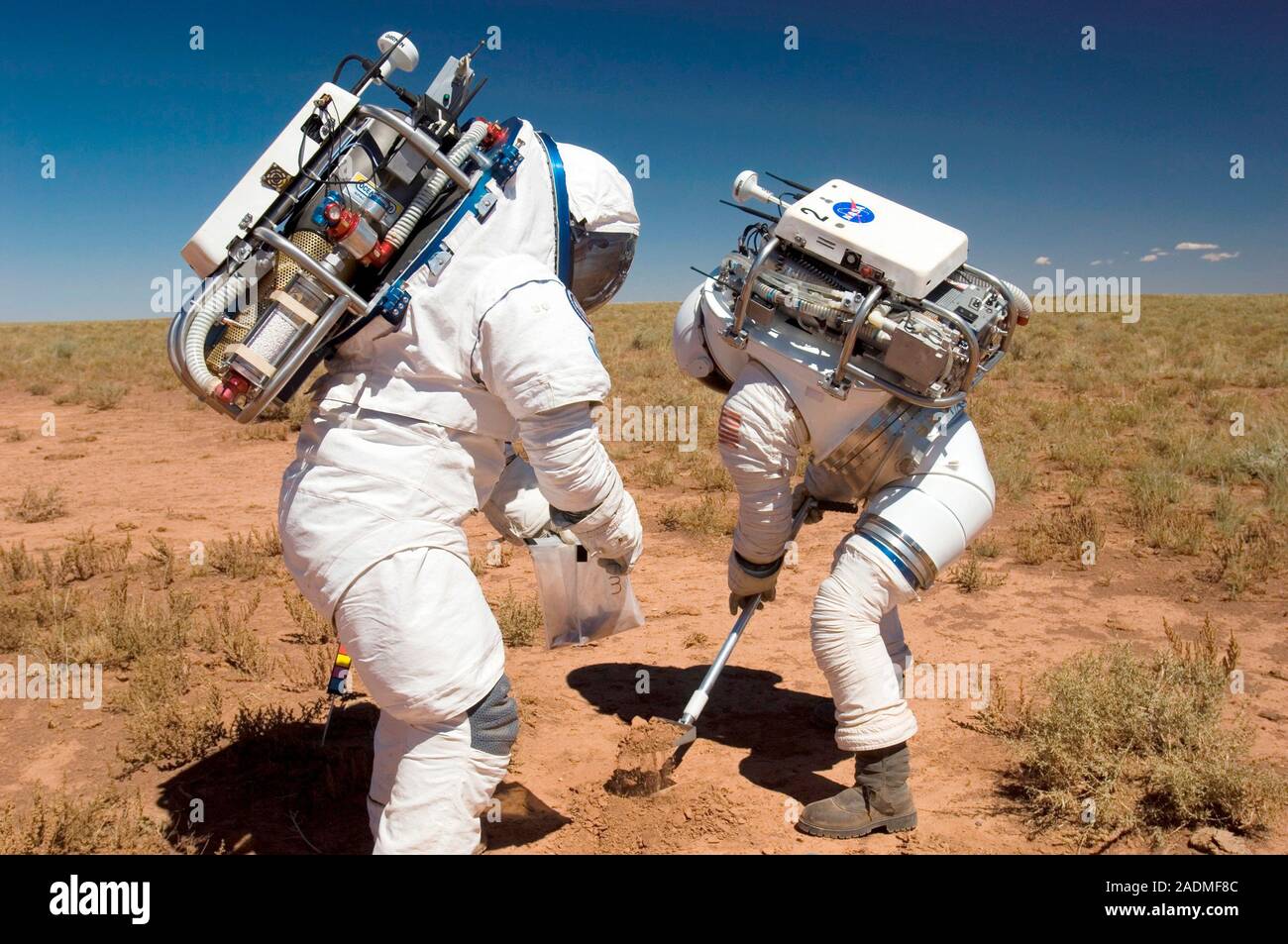 NASA field study. Scientists collecting soil samples during a field ...