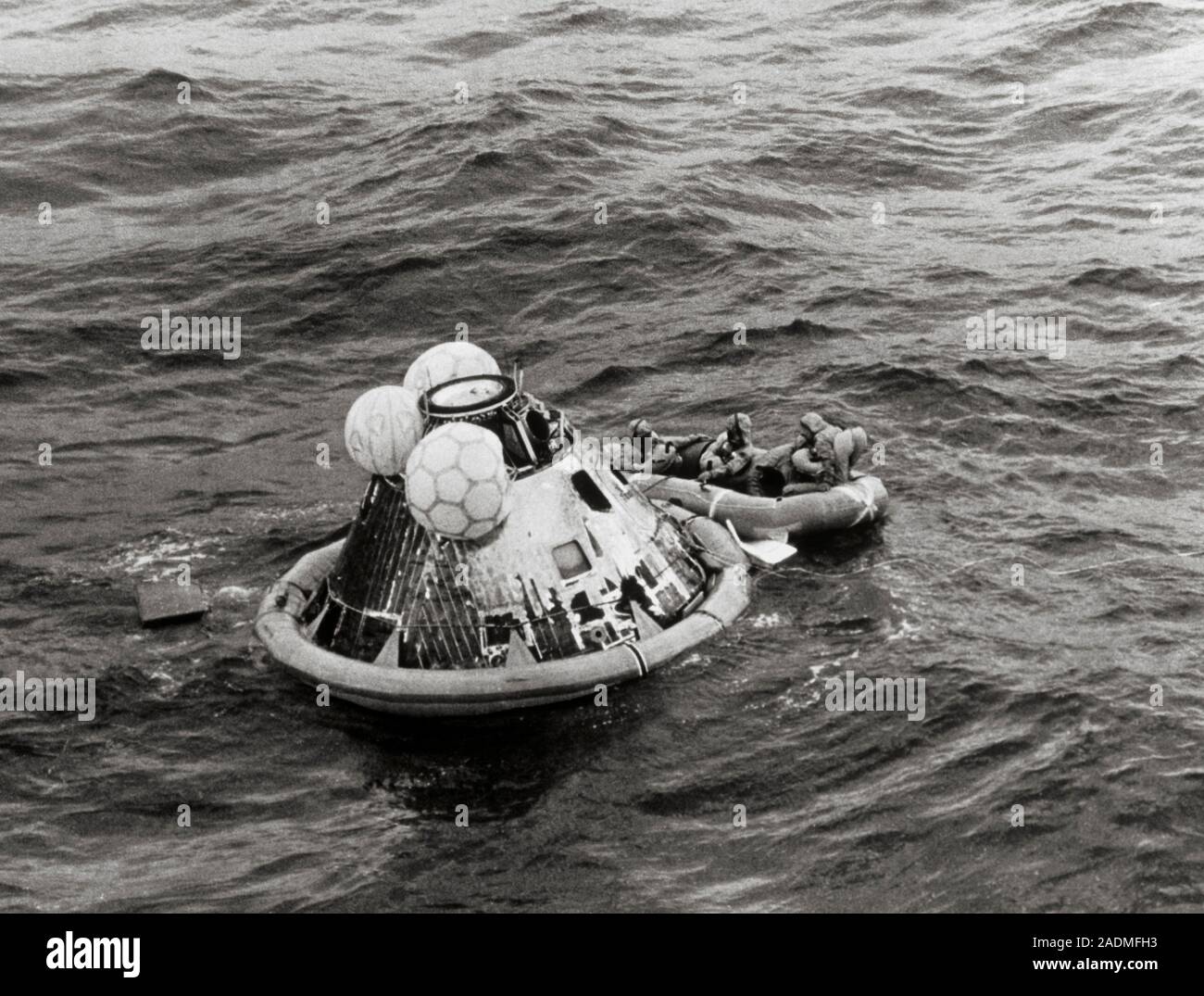Apollo 11 astronauts Neil Armstrong, Michael Collins and Edwin Aldrin wait for a recovery ...