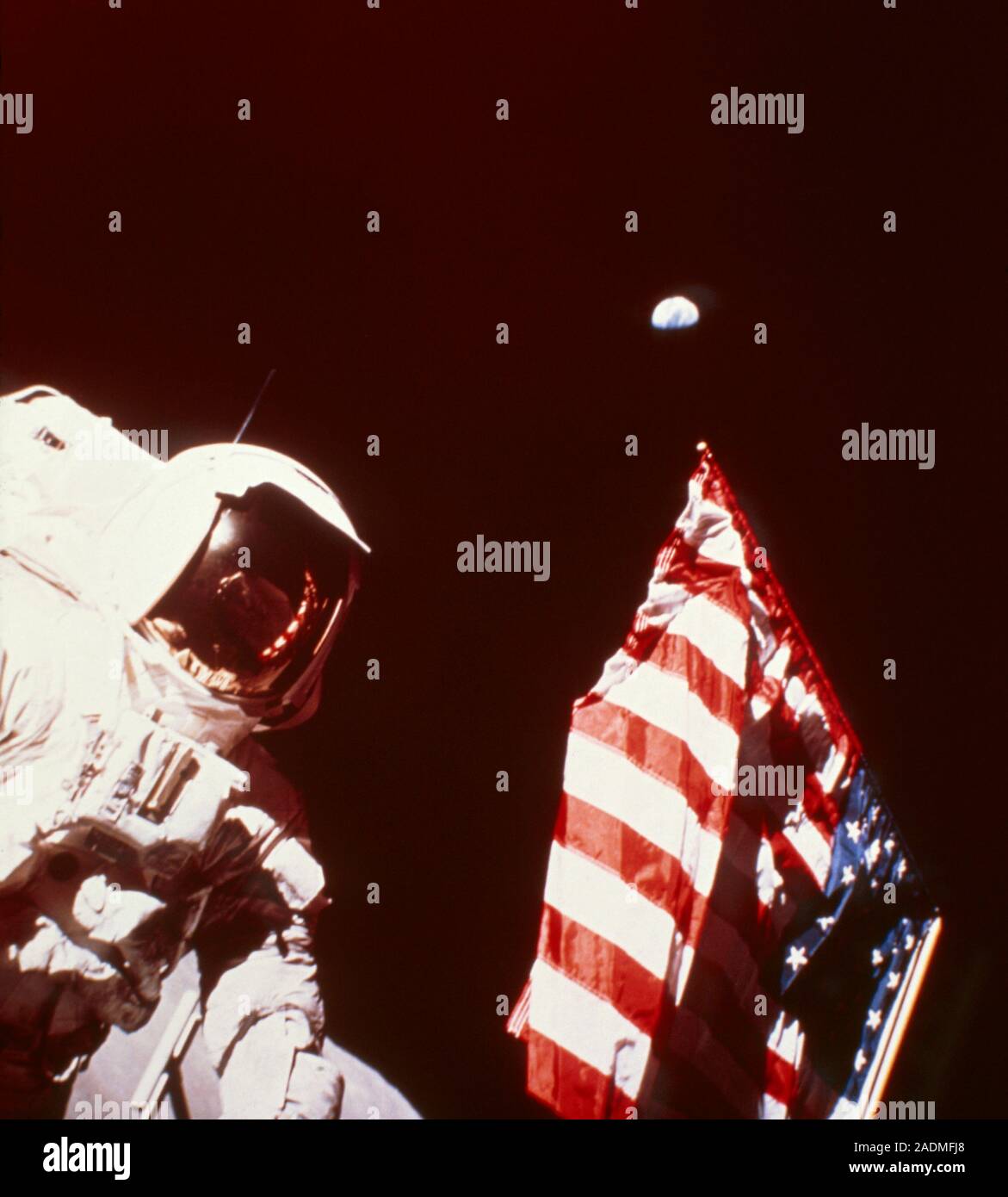 Astronaut Harrison Schmitt standing on the surface of the moon next to ...