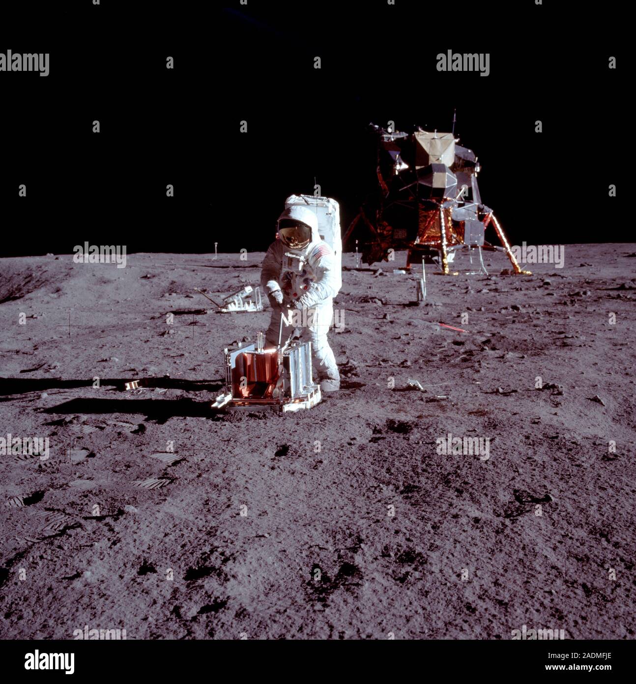 Astronaut Edwin E. Aldrin deploys the passive seismic experiment EASEP ...