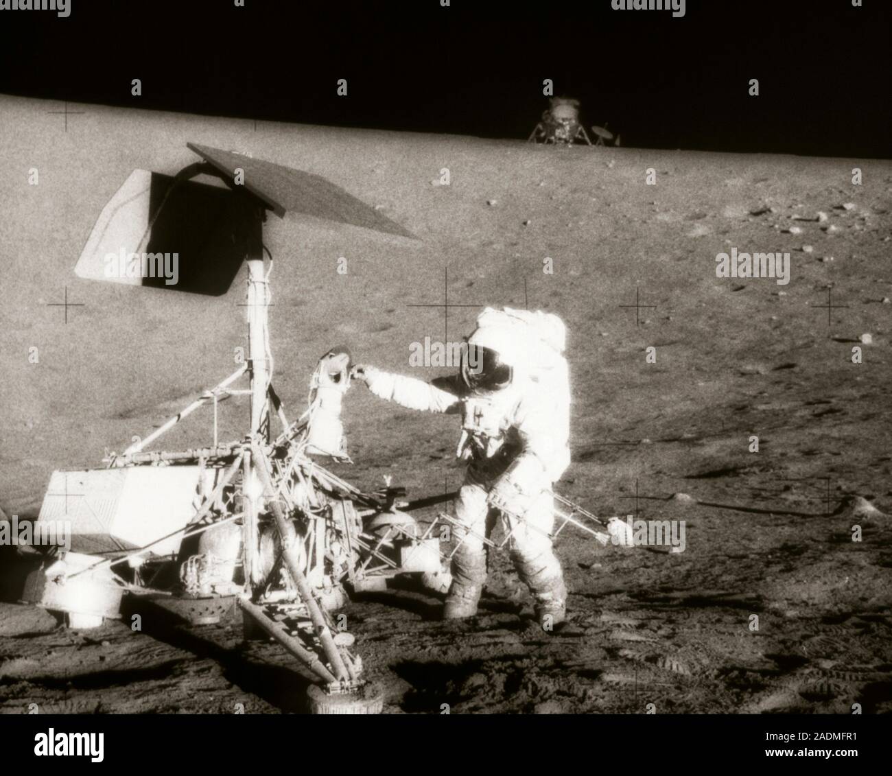 Lunar rendezvous: astronaut Charles Conrad standing next to the ...