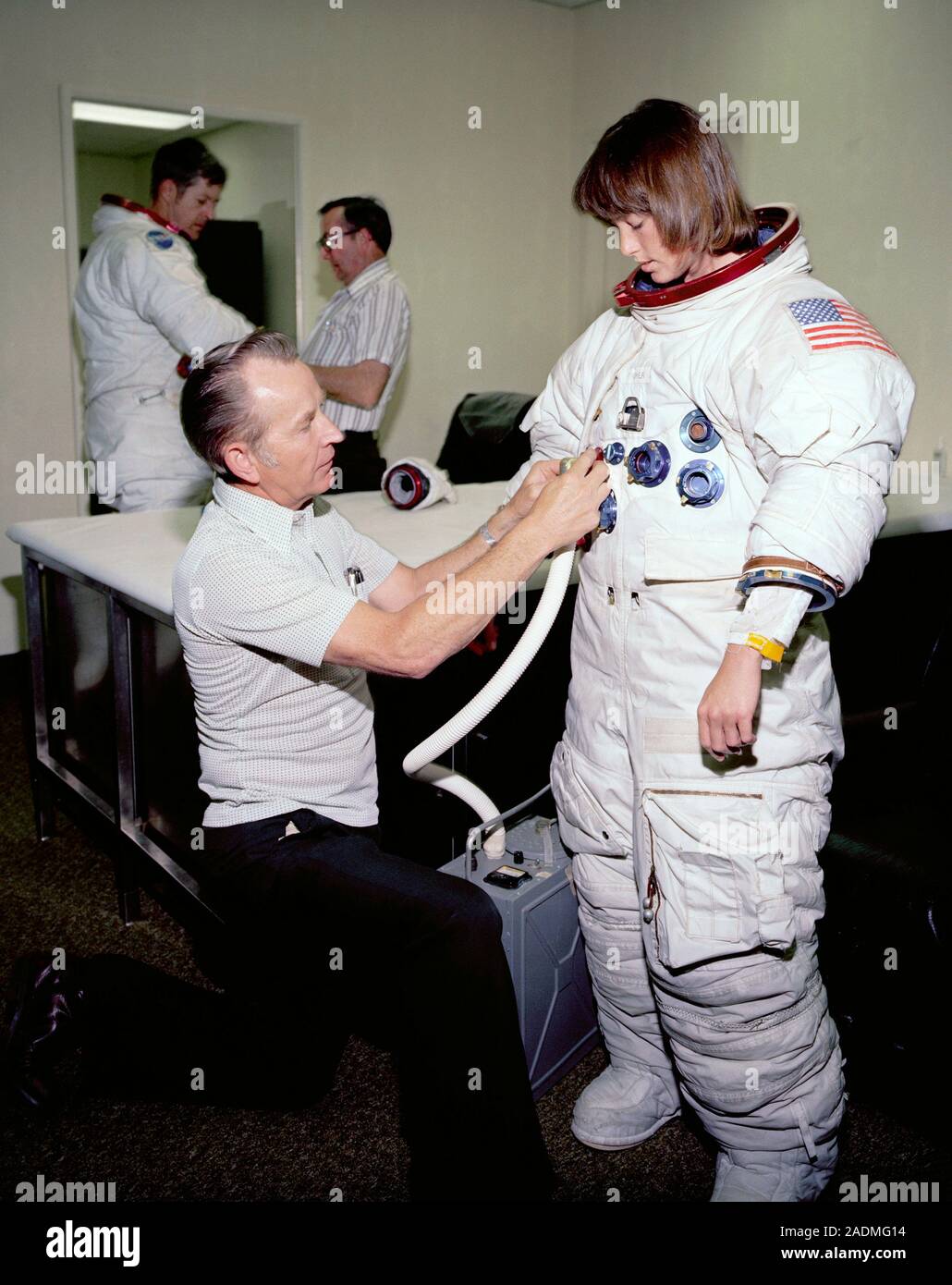 Astronauts Joe Kerwin & Anna Fisher suit up for exercises in the ...