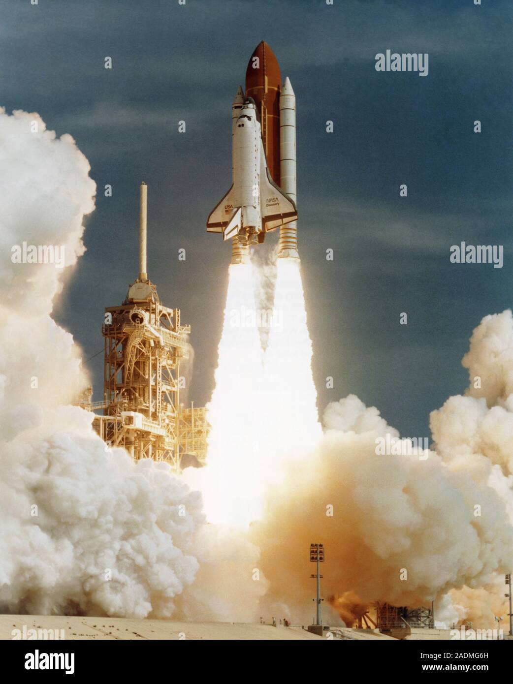Launch of shuttle mission STS-70. Space Shuttle Discovery begins its 21st spaceflight from a ...