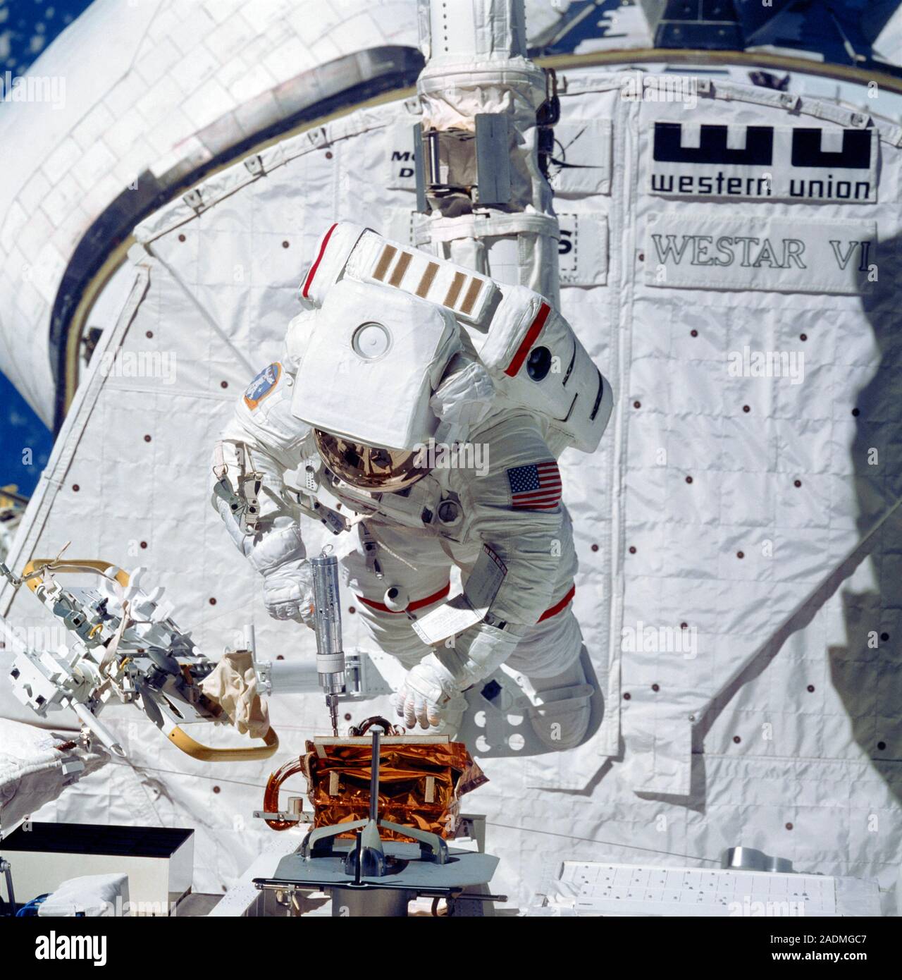 Space Shuttle astronaut Bruce McCandless using special tool during EVA ...