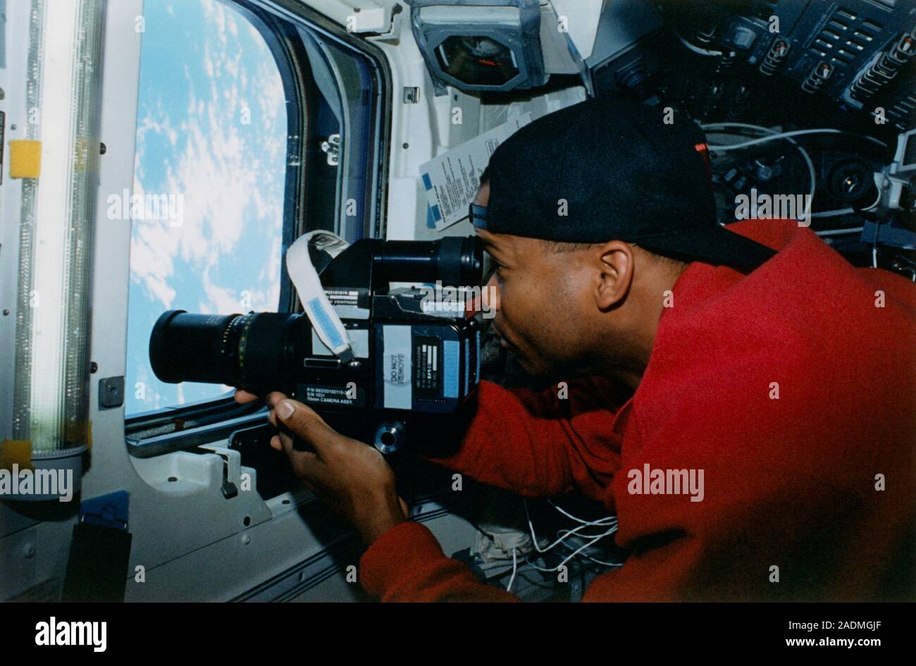 Filming in space. Astronaut Robert L. Curbeam operates a hand-held 70 ...