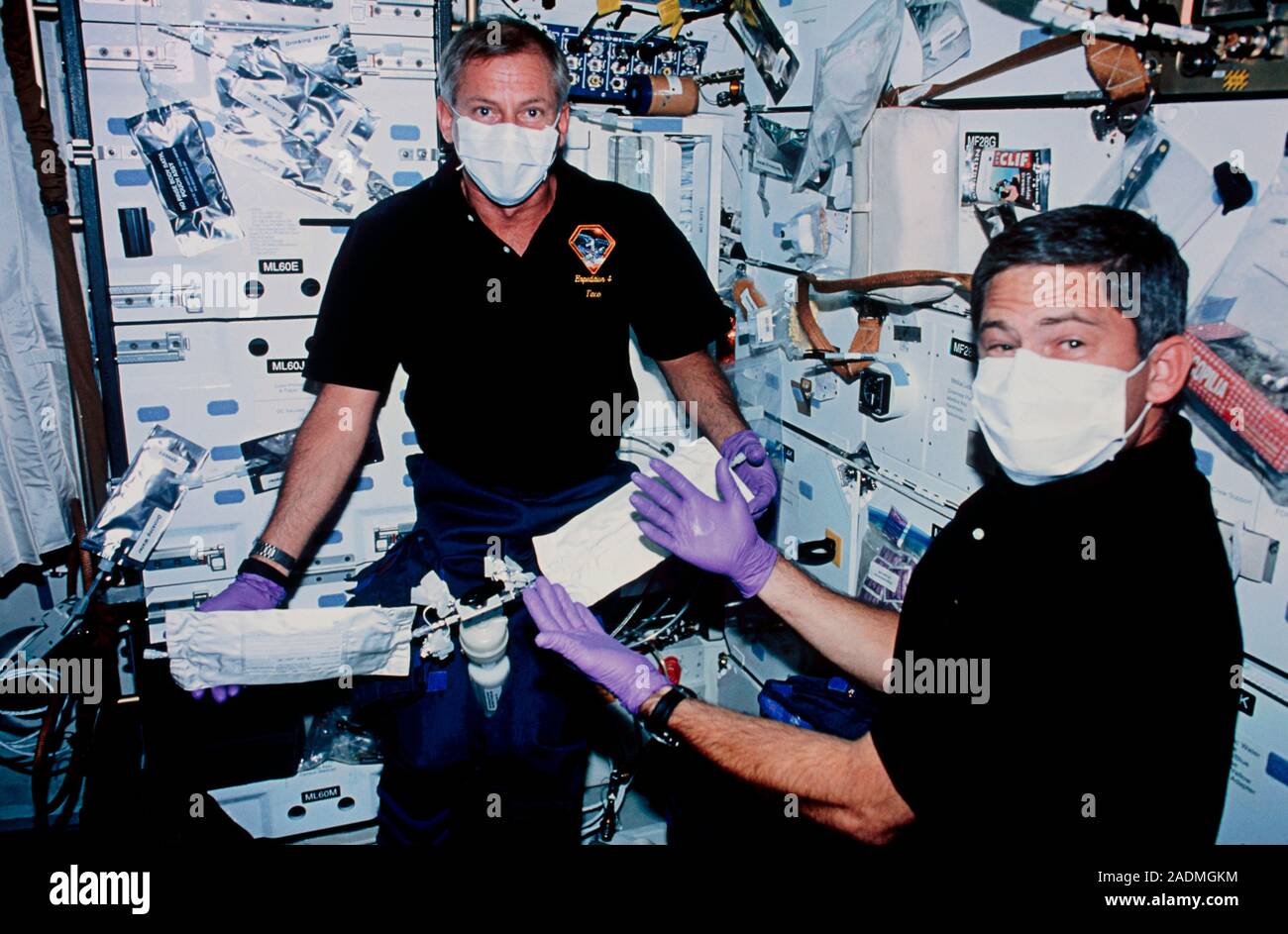 Shuttle experiment. Astronauts on Space Shuttle Endeavour testing a ...