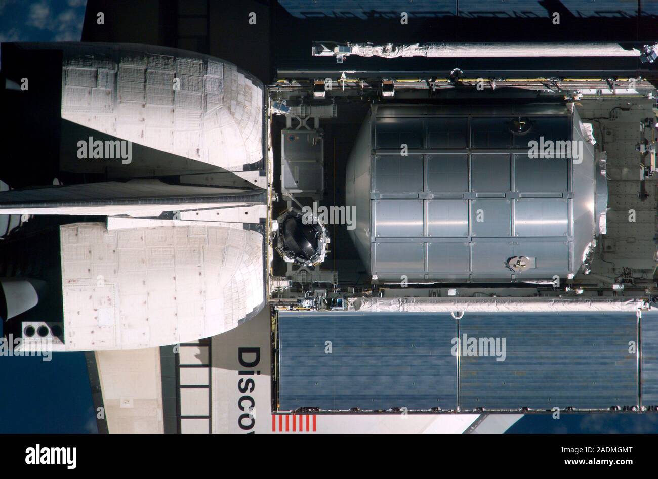Space shuttle Discovery docking with the International Space Station ...