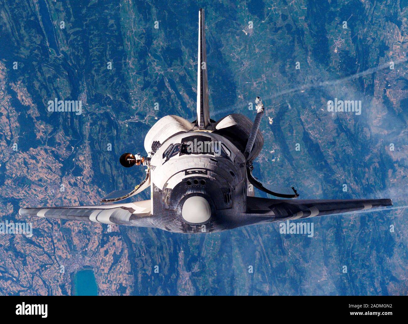 Space shuttle Discovery approaching the International Space Station ...