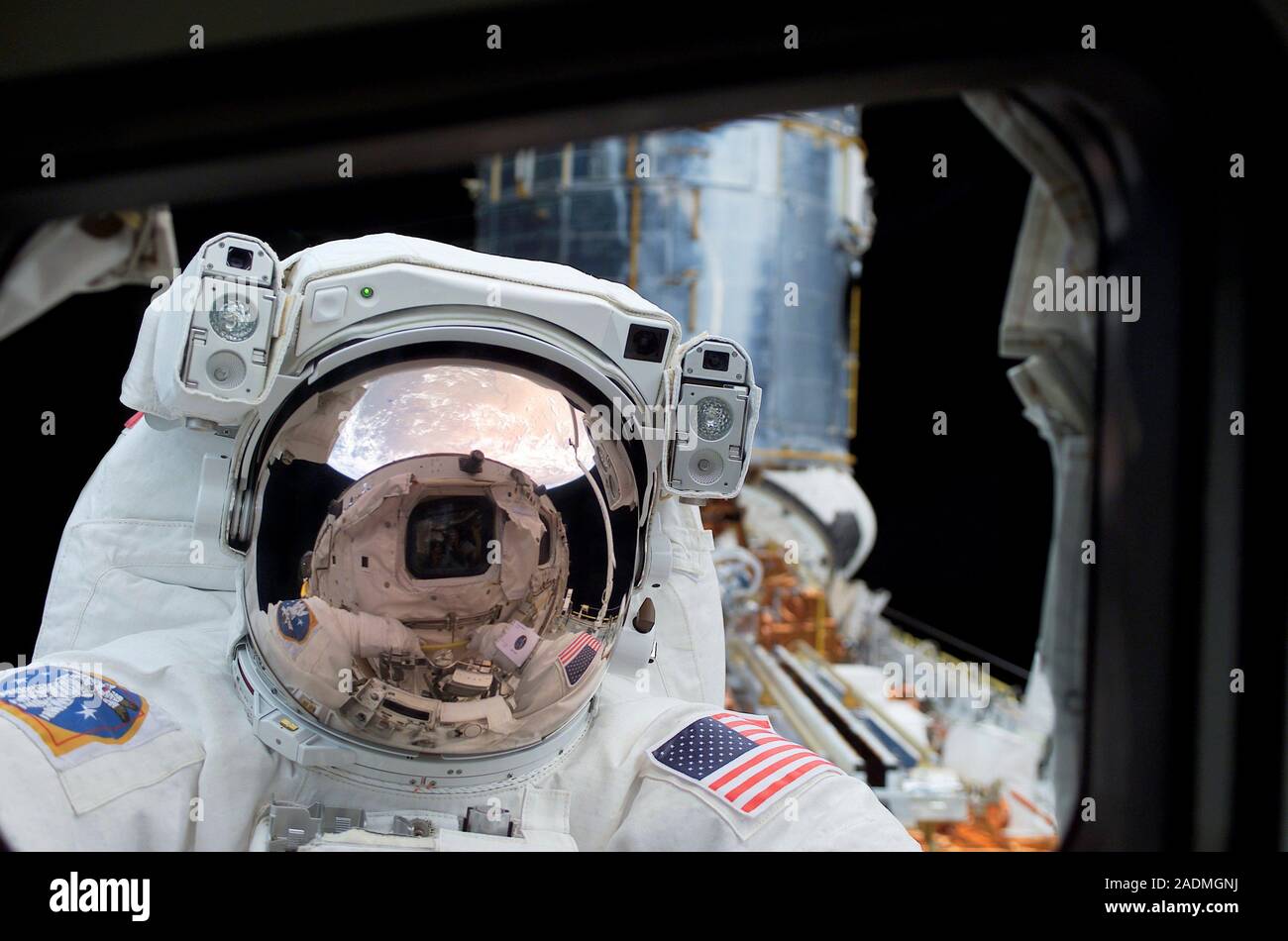 STS-109 spacewalk. American astronaut John M. Grunsfeld during extravehicular activity (EVA, or ...