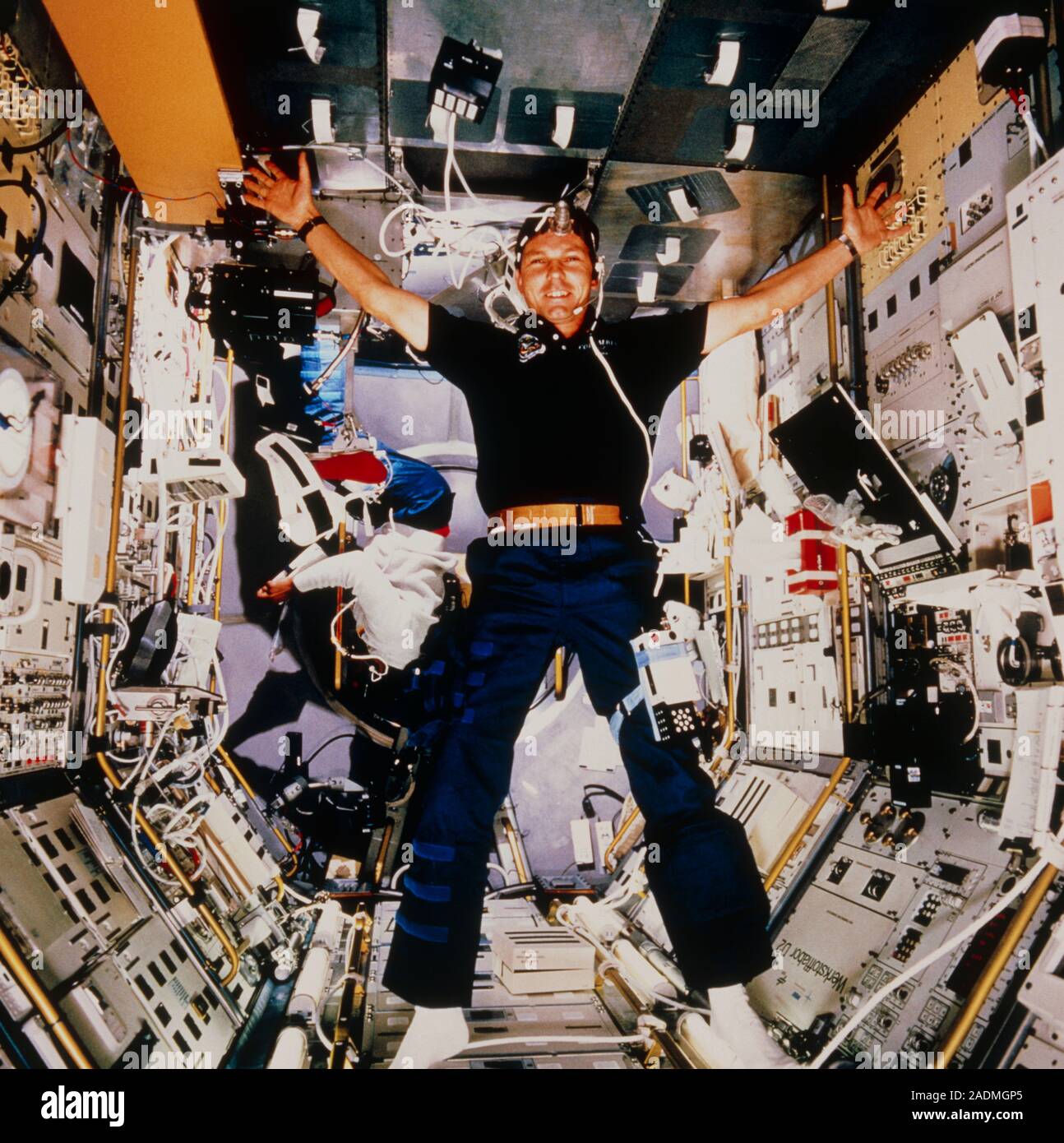 Weightlessness. German astronaut Hans Schlegel floats 'upside down ...