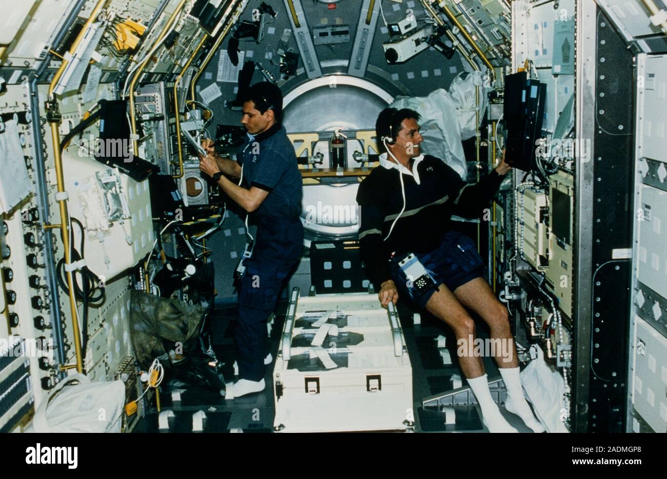Spacelab experiments. Astronauts Donald Thomas (right) and Gregory ...