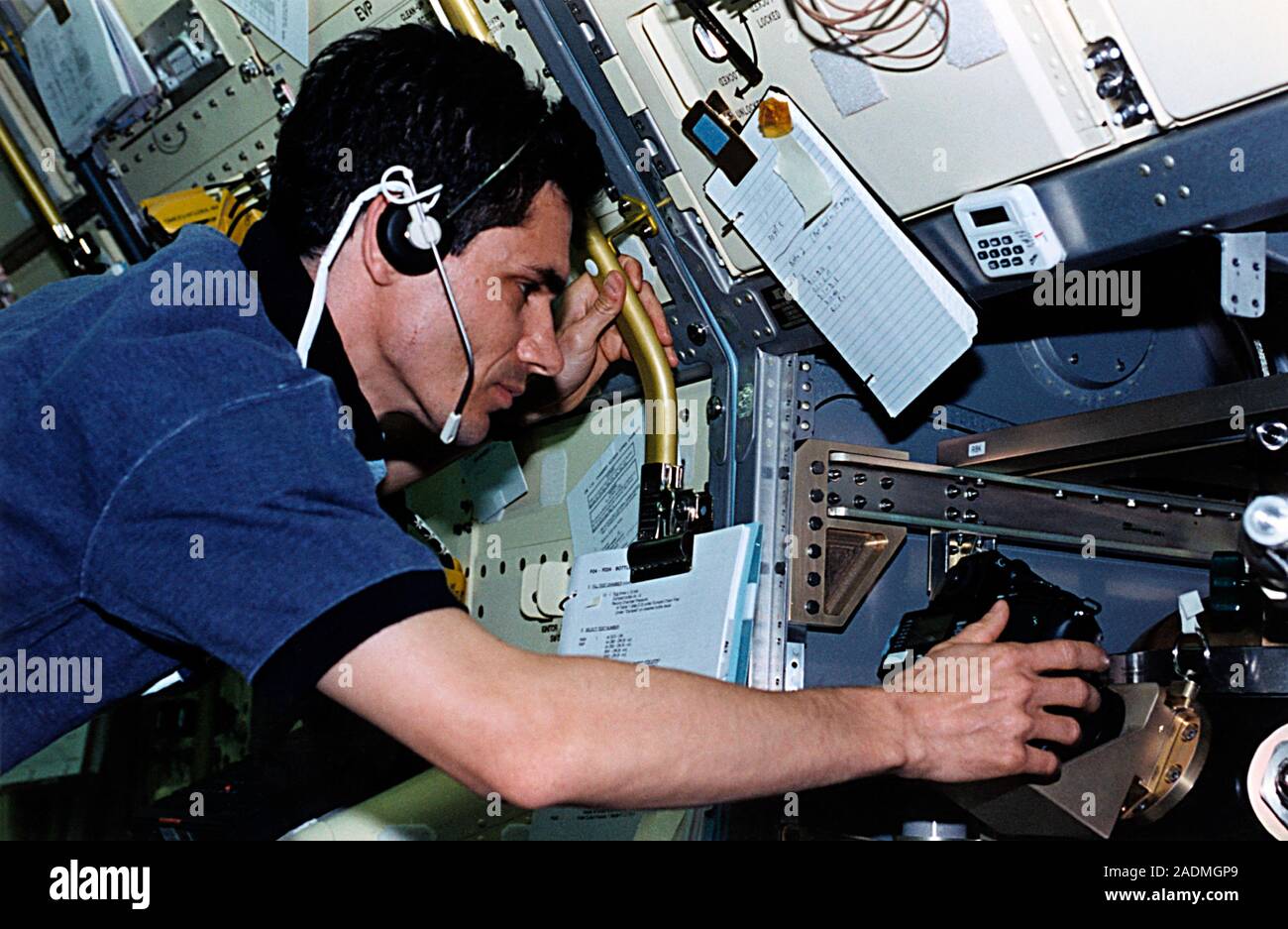 Spacelab experiment. Astronaut Gregory Linteris conducts an experiment ...