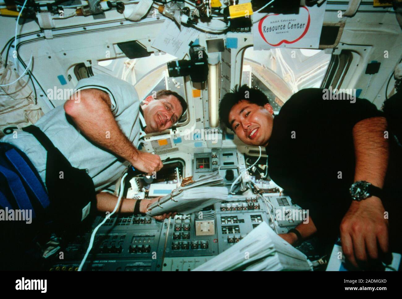 Space Shuttle astronauts. Astronauts Koichi Wakata (right) and Peter J K Wisoff (left) compare ...