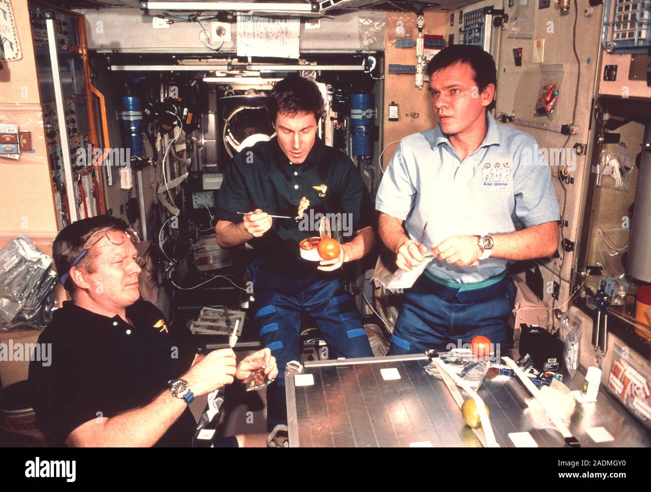 ISS crew eating. Expedition One crew eating in the Zvezda module of the ...
