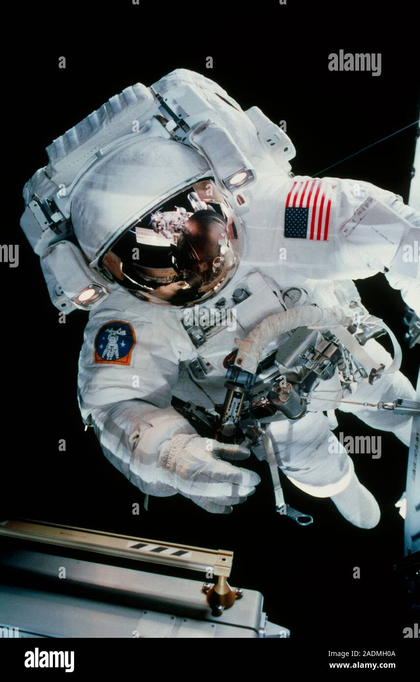 ISS space walk. Astronaut Patrick Forrester works on an experiment ...